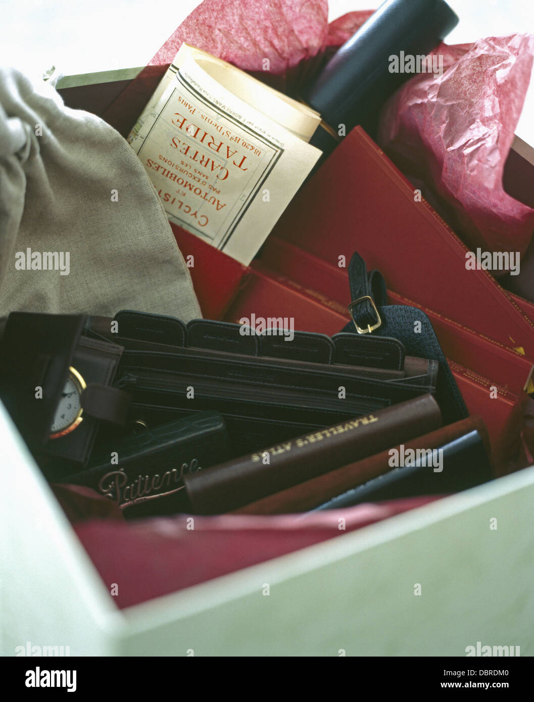 Close-up of box of books and bags in white box Stock Photo - Alamy