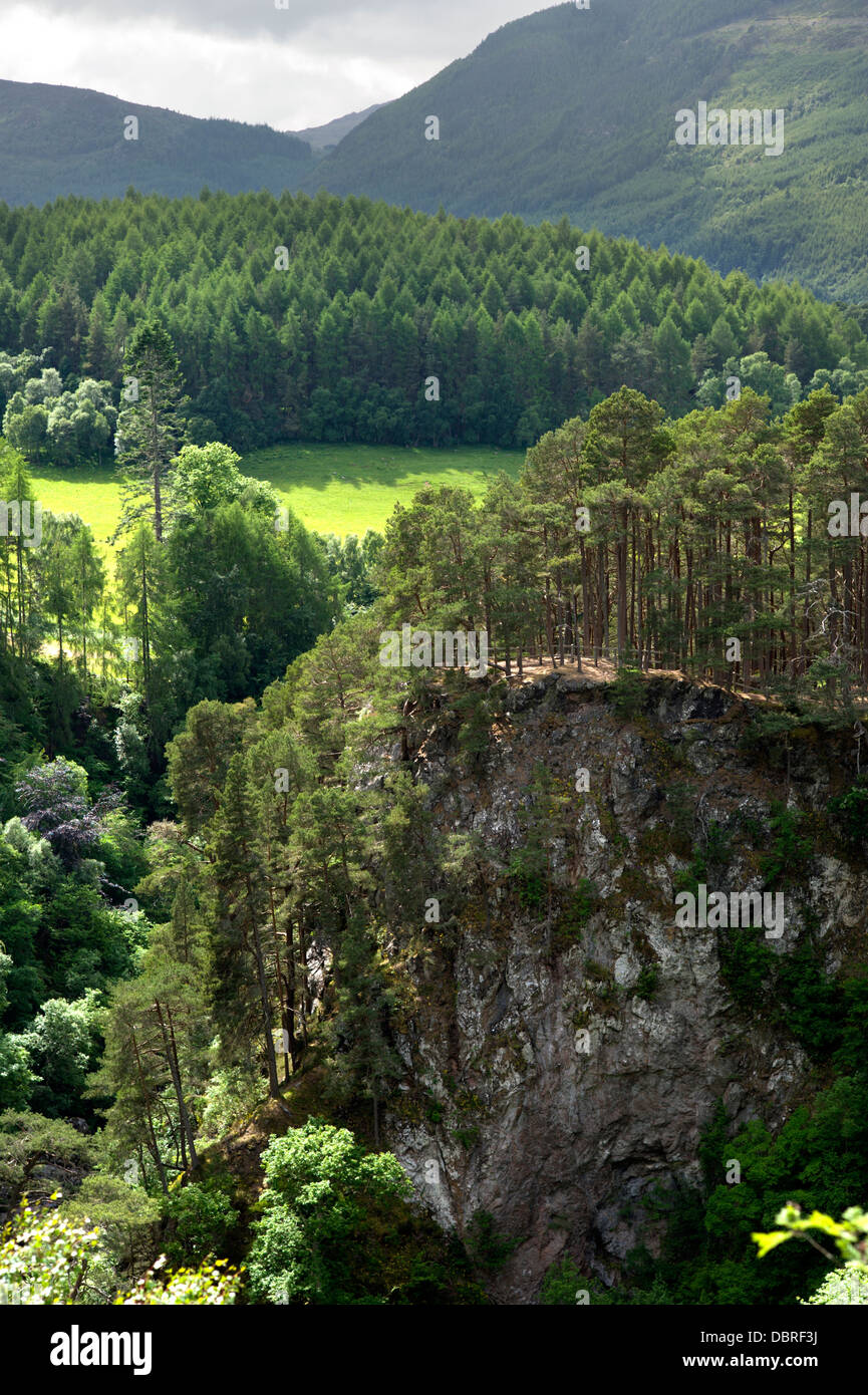 Rock and woodland above the gorge at the Falls of Foyers near Inverness ...