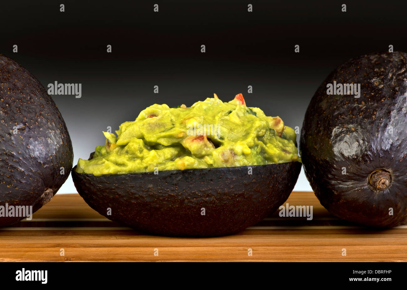 Guacamole and fresh avocados Stock Photo - Alamy