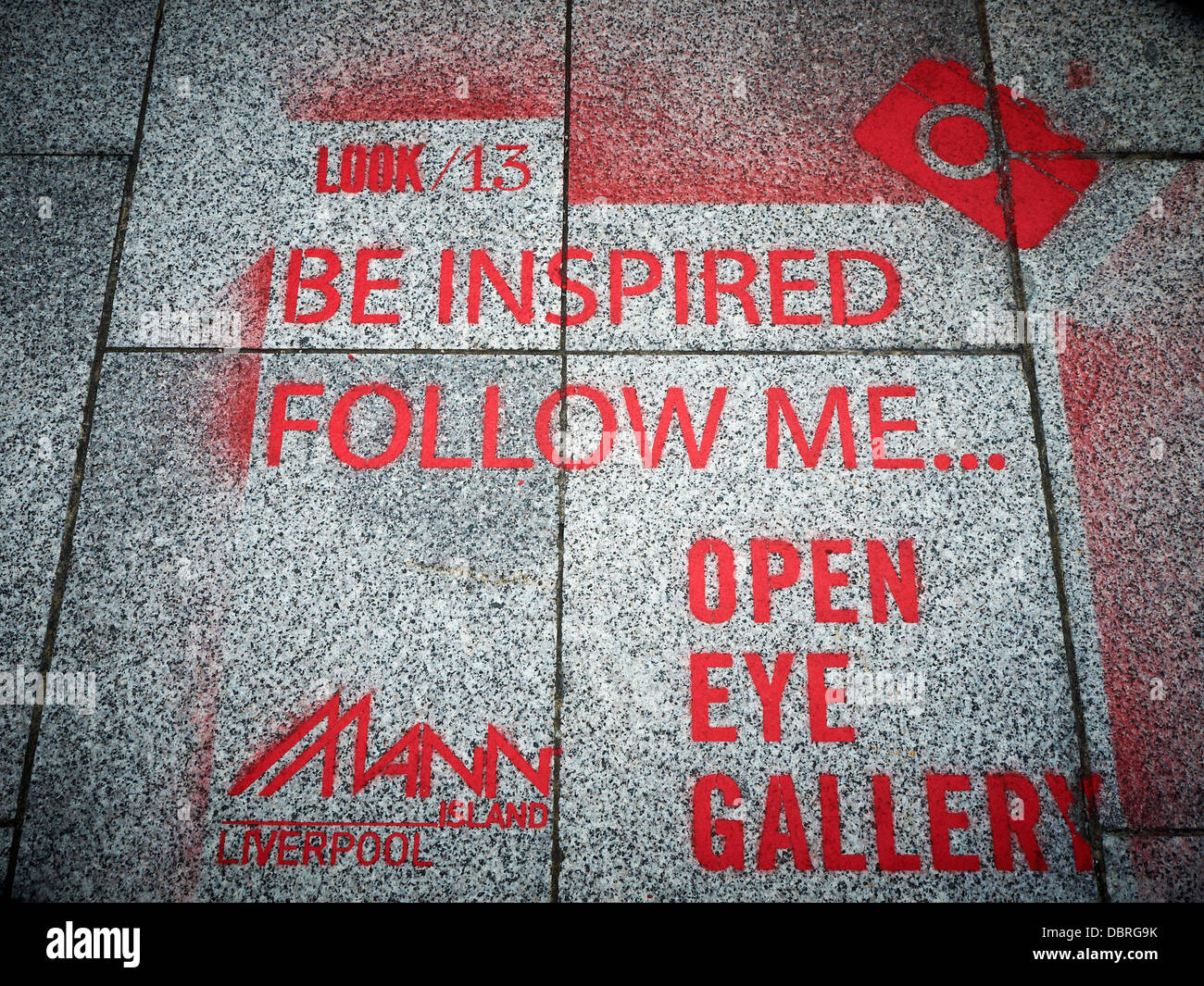 Open eye gallery advert sprayed on pavement in Liverpool UK Stock Photo ...