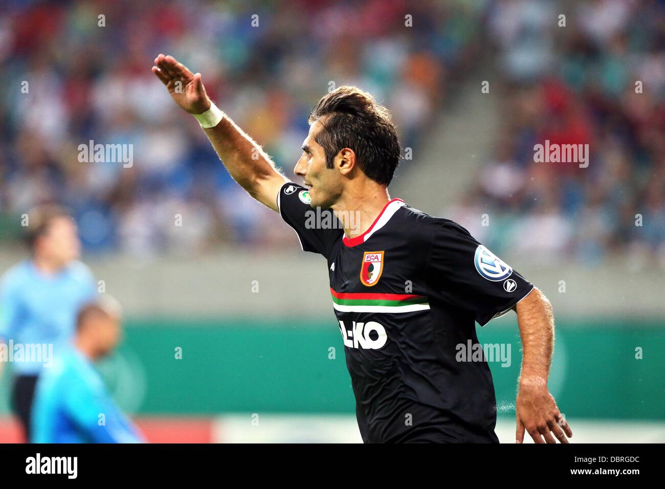 Augsburg's Halil Altintop celebrates after his 2-0 goal during the ...