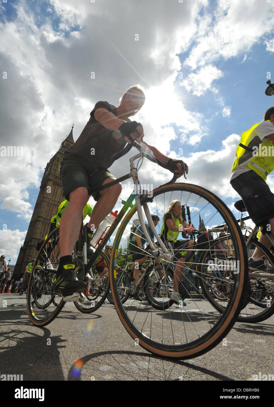 Westminster, London, UK. 3rd August 2013. Cyclists pass Big Ben as they ...