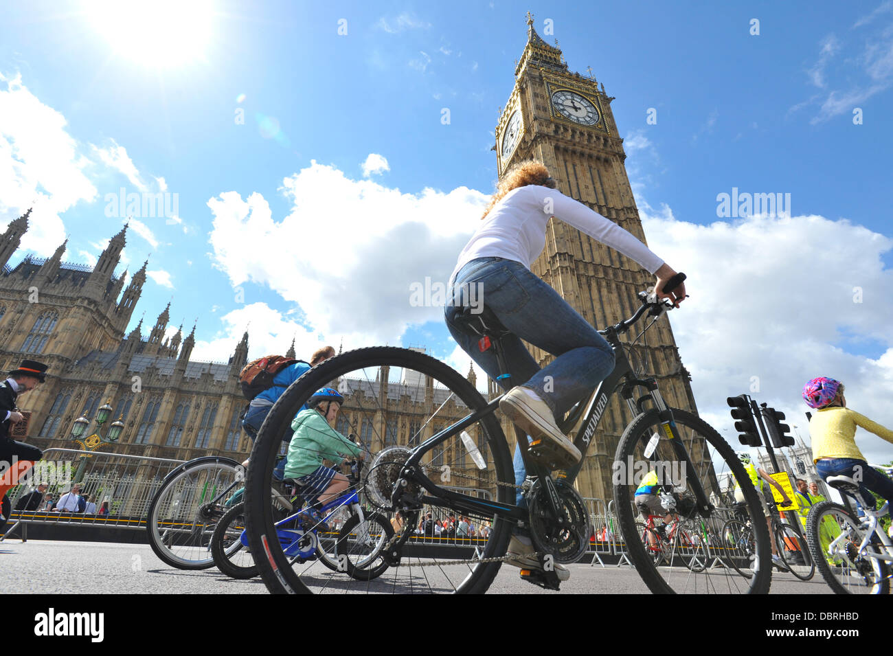 Westminster, London, UK. 3rd August 2013. Cyclists pass Big Ben as they ...
