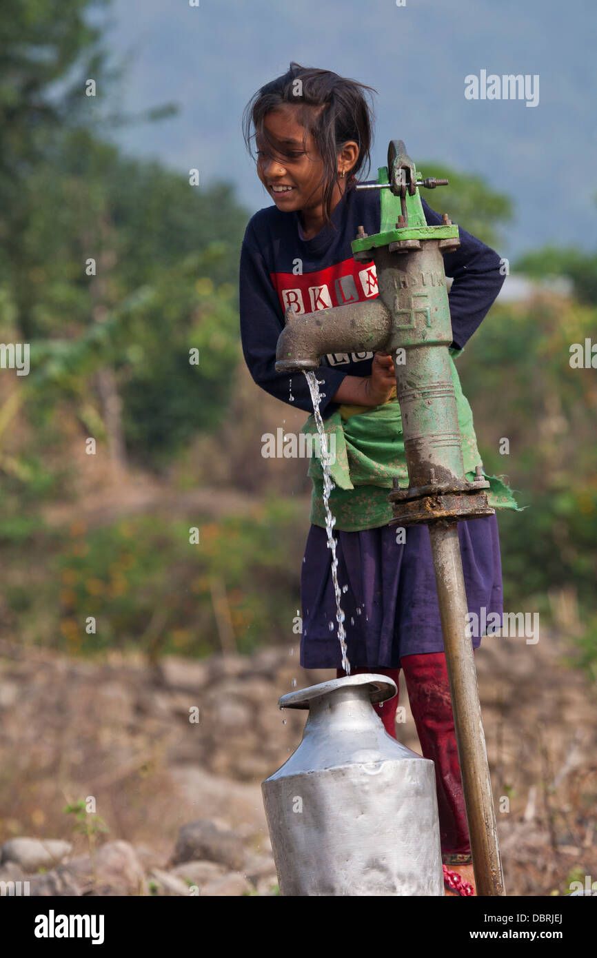 Collecting water near Chisopani, Western Nepal Stock Photo - Alamy
