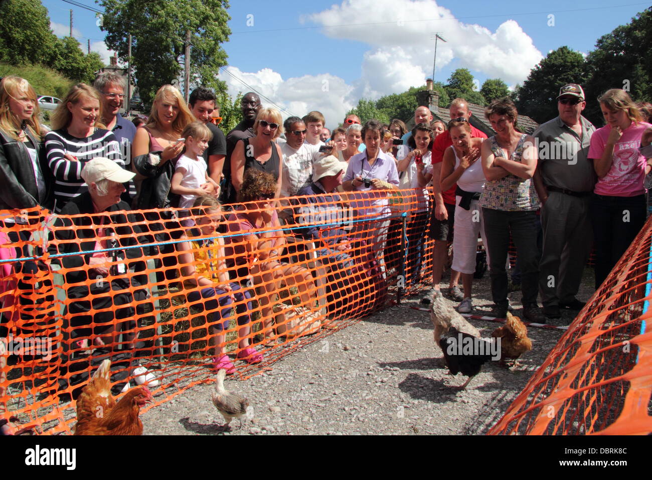Competitors & their fowl at The Hen Racing World Championships outside ...
