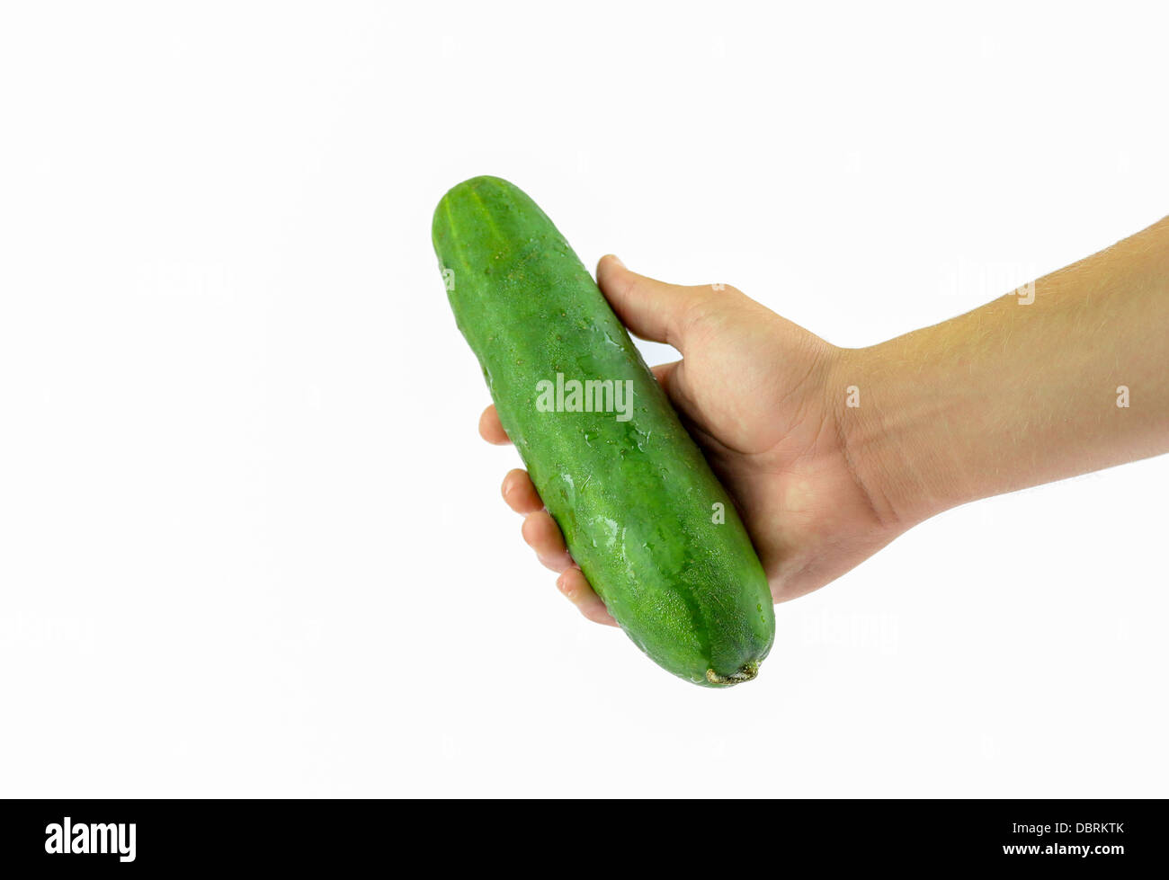 Man hand showing a fresh cucumber Stock Photo - Alamy