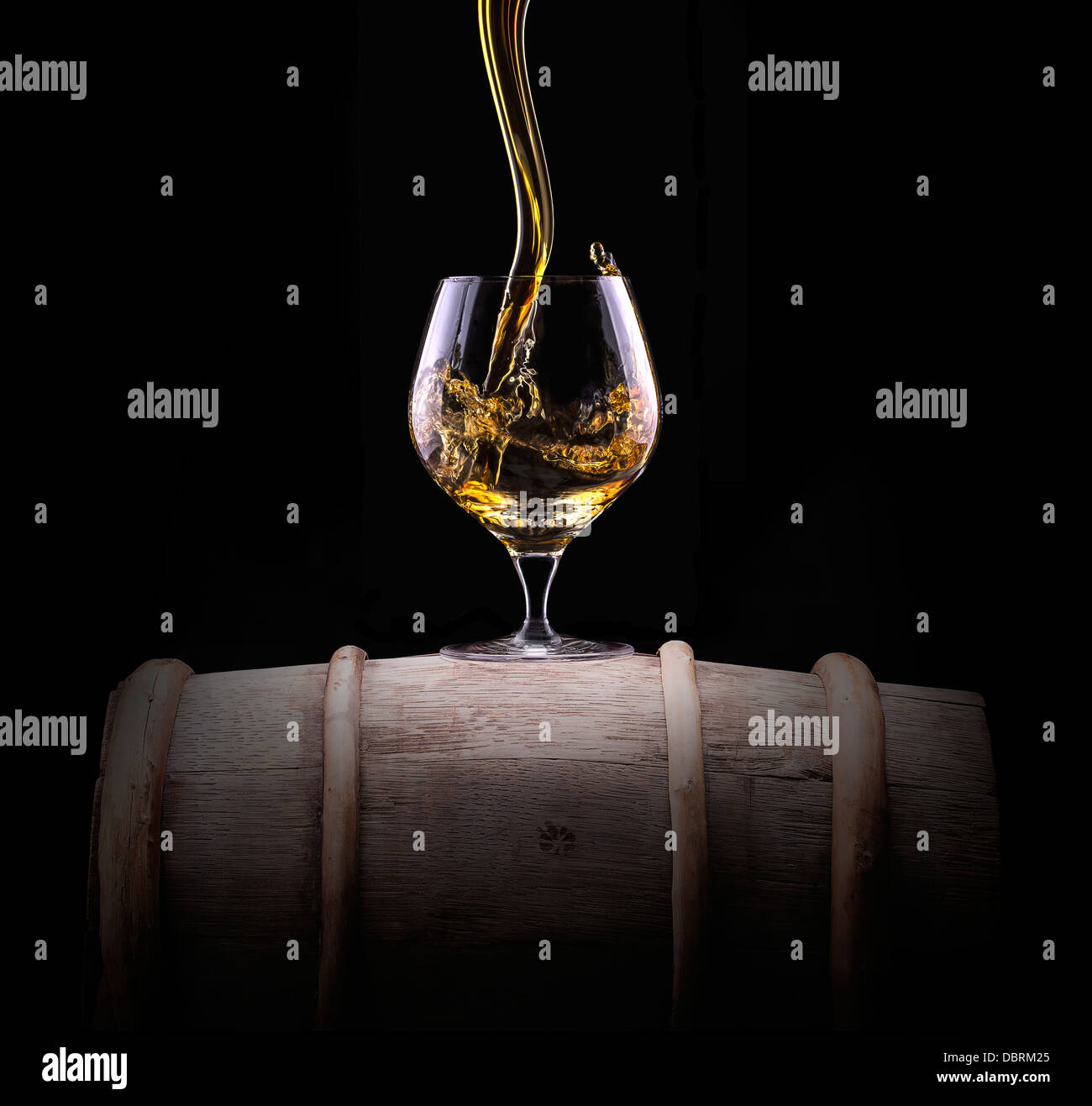 Cognac or brandy on a black background Stock Photo - Alamy