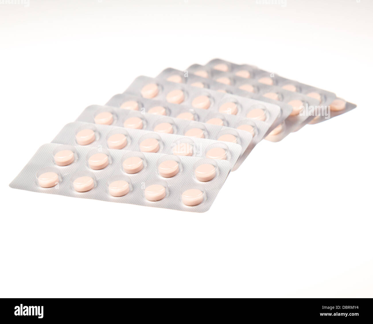 Tablets on isolated white background Stock Photo - Alamy