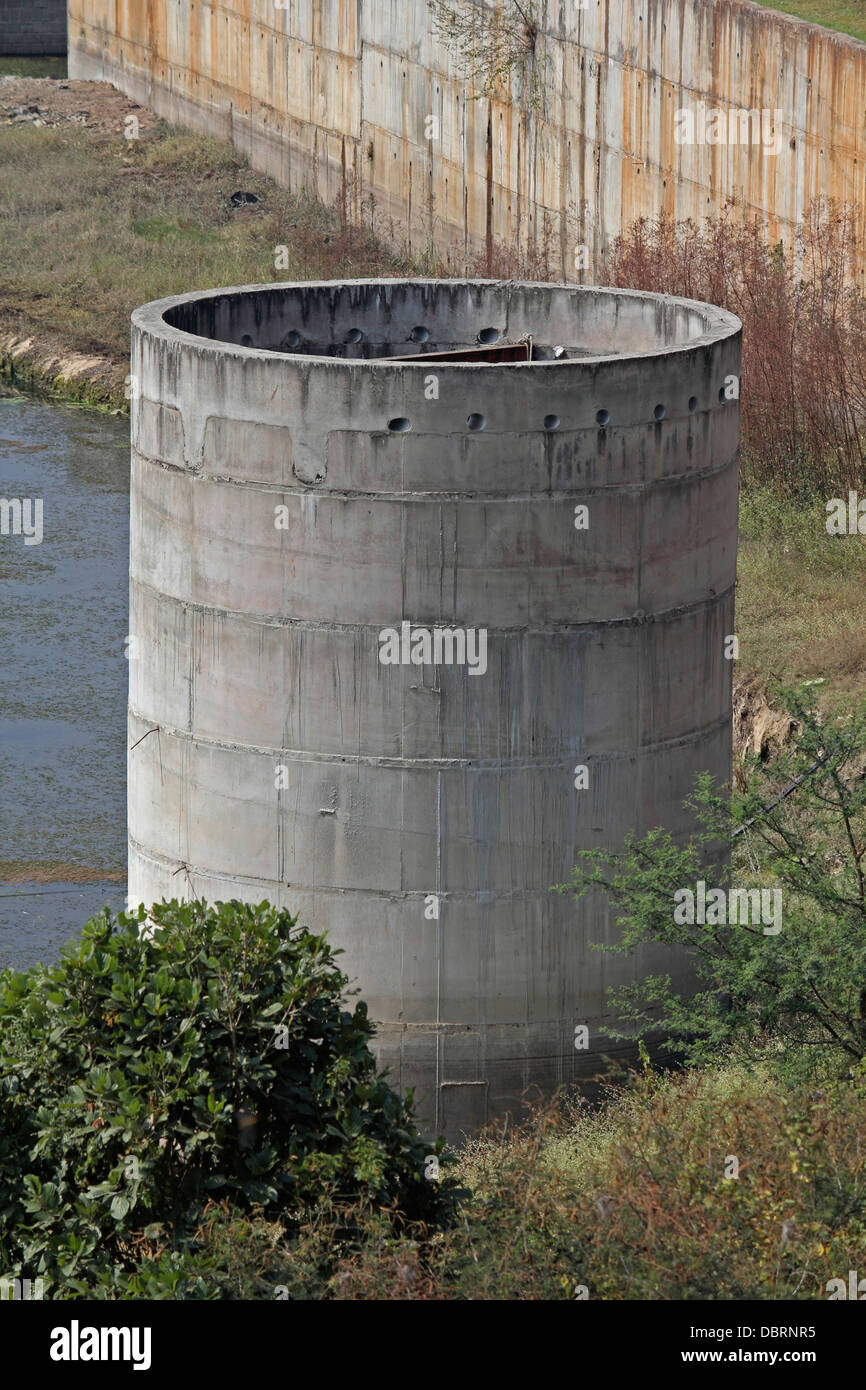 large cement well in river Stock Photo - Alamy
