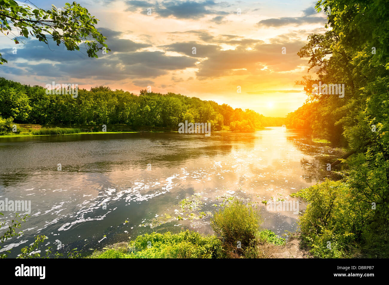 Beautiful cloudy sunset over river hi-res stock photography and images ...