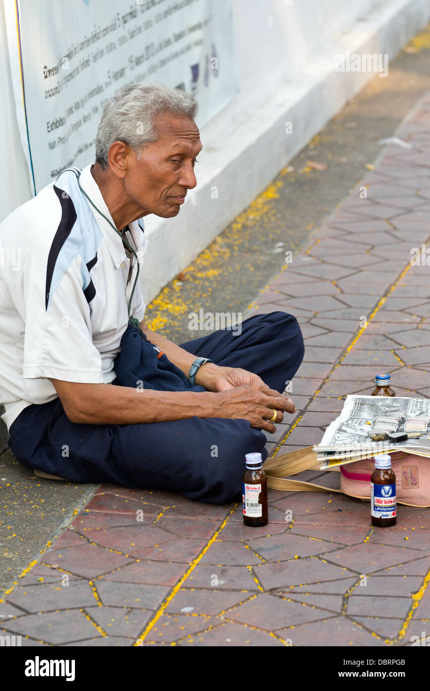 Men sitting on a Walkway in Bangkok, Thailand Stock Photo - Alamy