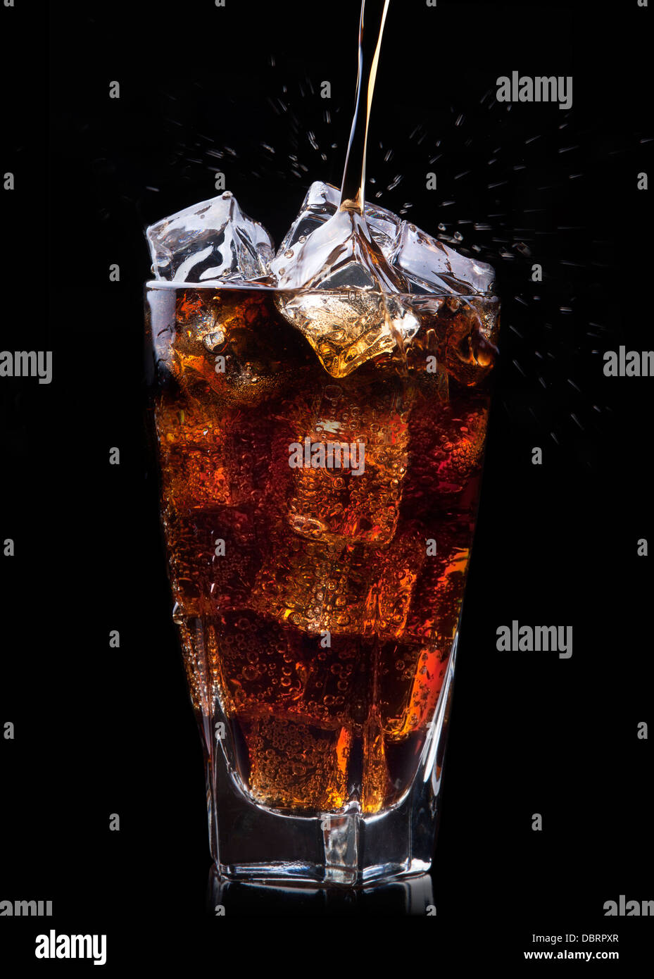 Fresh cola drink background with ice and splash on a black Stock Photo ...