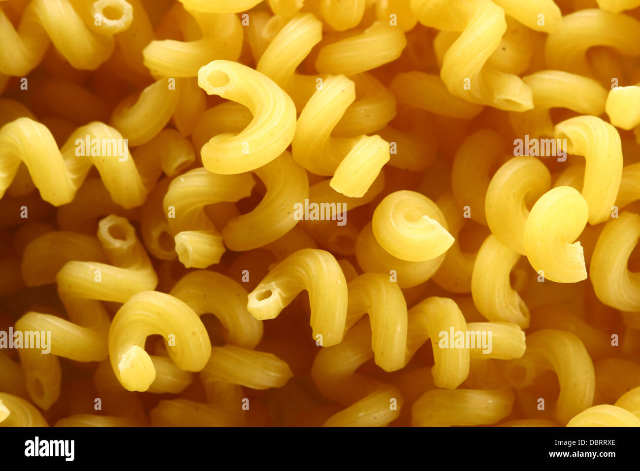 macro Macaroni yellow food background Stock Photo - Alamy