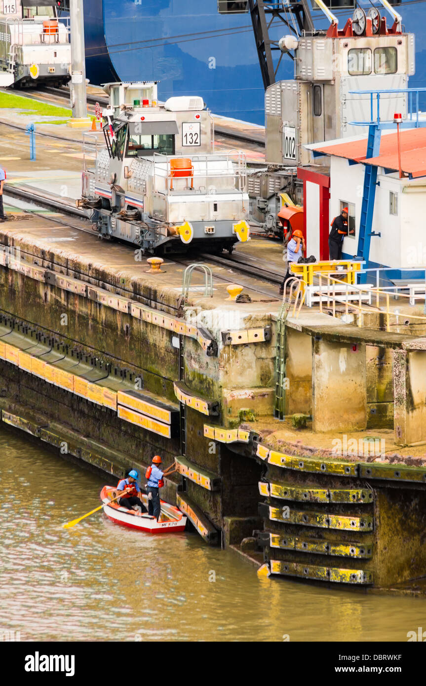Panama Canal Panama Workers prepare to move a ship through Miraflores ...