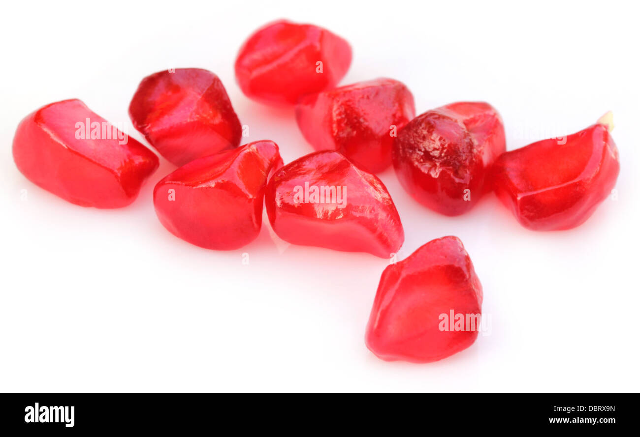 Pulp of pomegranate over white background Stock Photo - Alamy