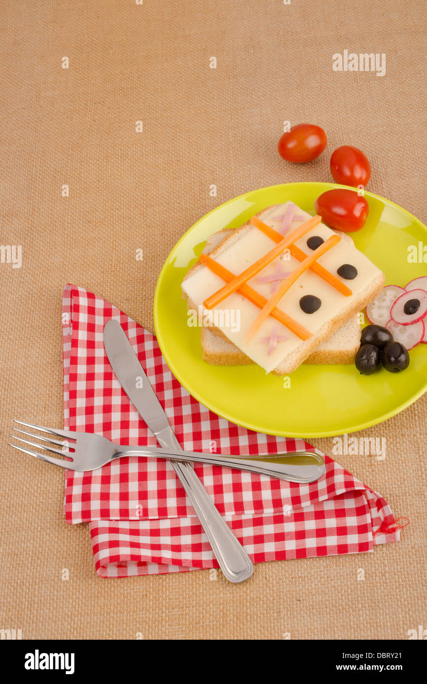 Ham and cheese with a colorful vegetable decoration, food for children ...