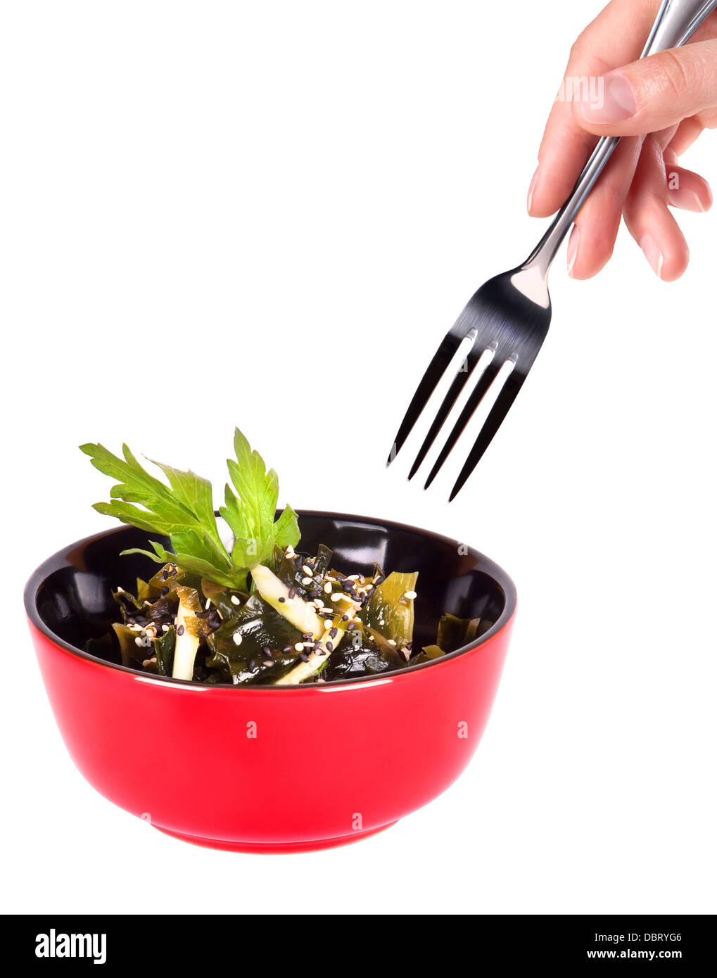Healthy Chinese food in a red plate and hand with fork isolated on a ...