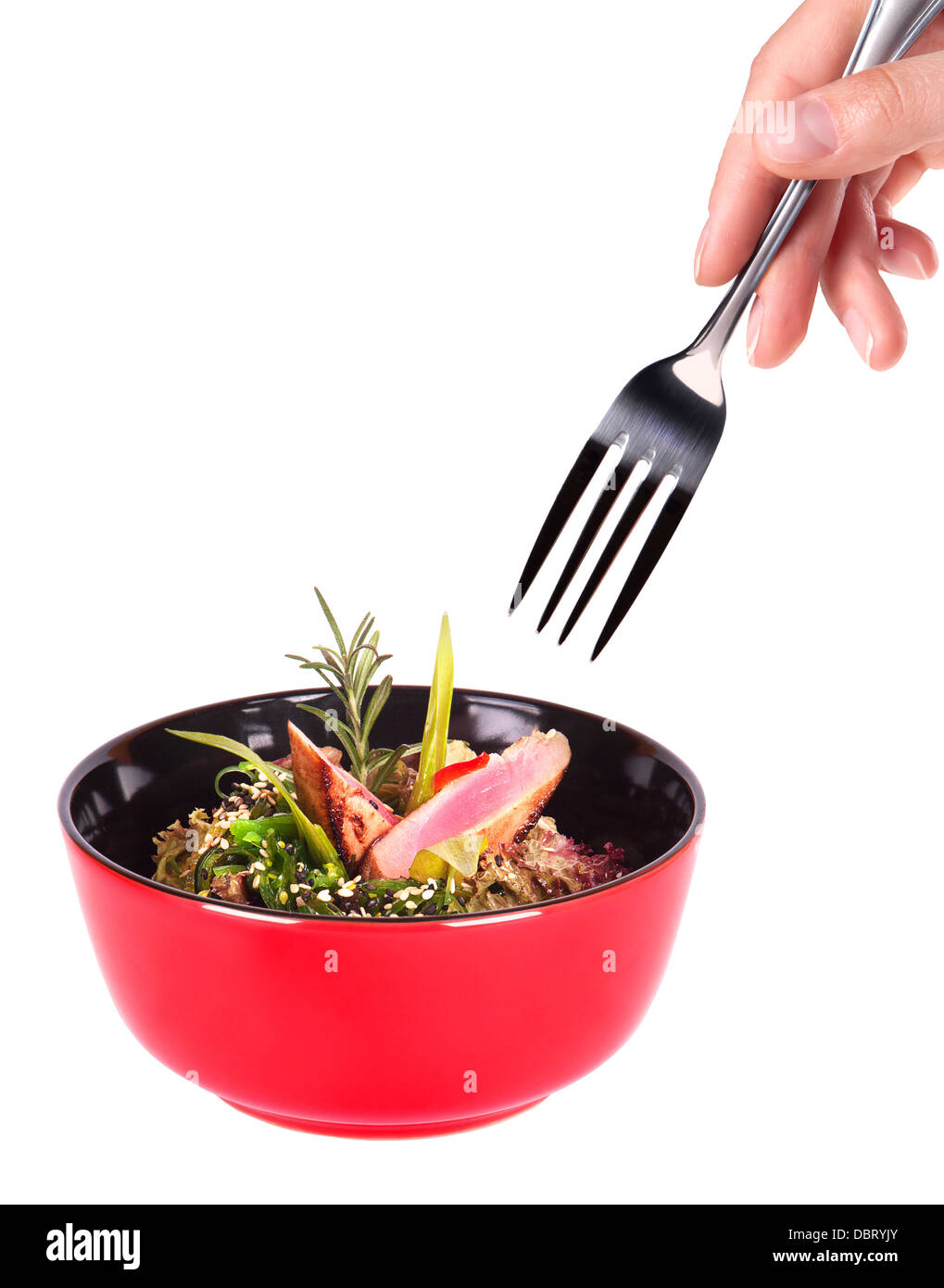 Healthy Chinese food in a red plate and hand with fork isolated on a ...