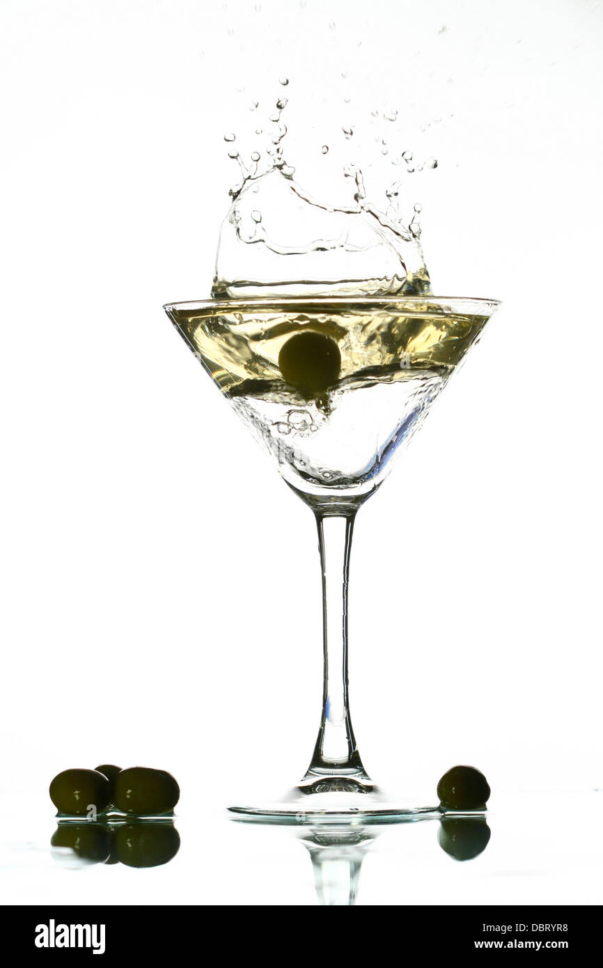martini splash on white bar background Stock Photo - Alamy