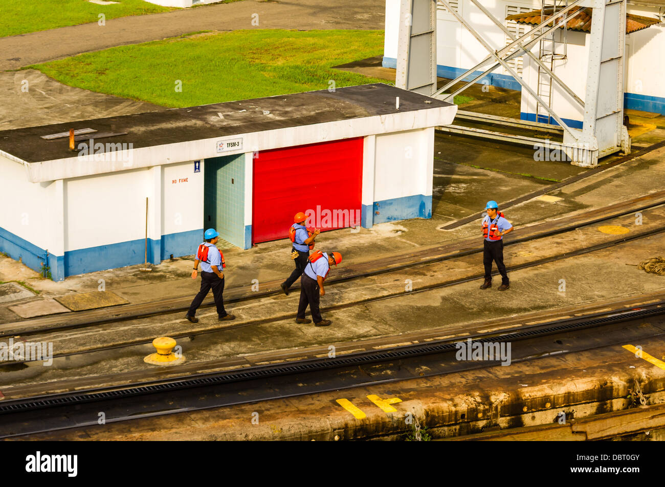 Panama Canal Panama Workers prepare to move a ship through Miraflores ...