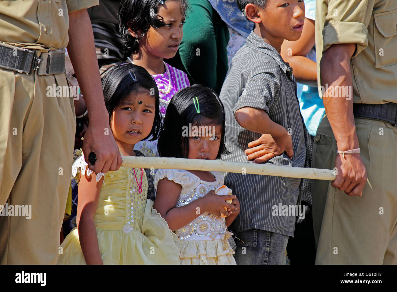 innocent girls behind Security Man Stock Photo - Alamy