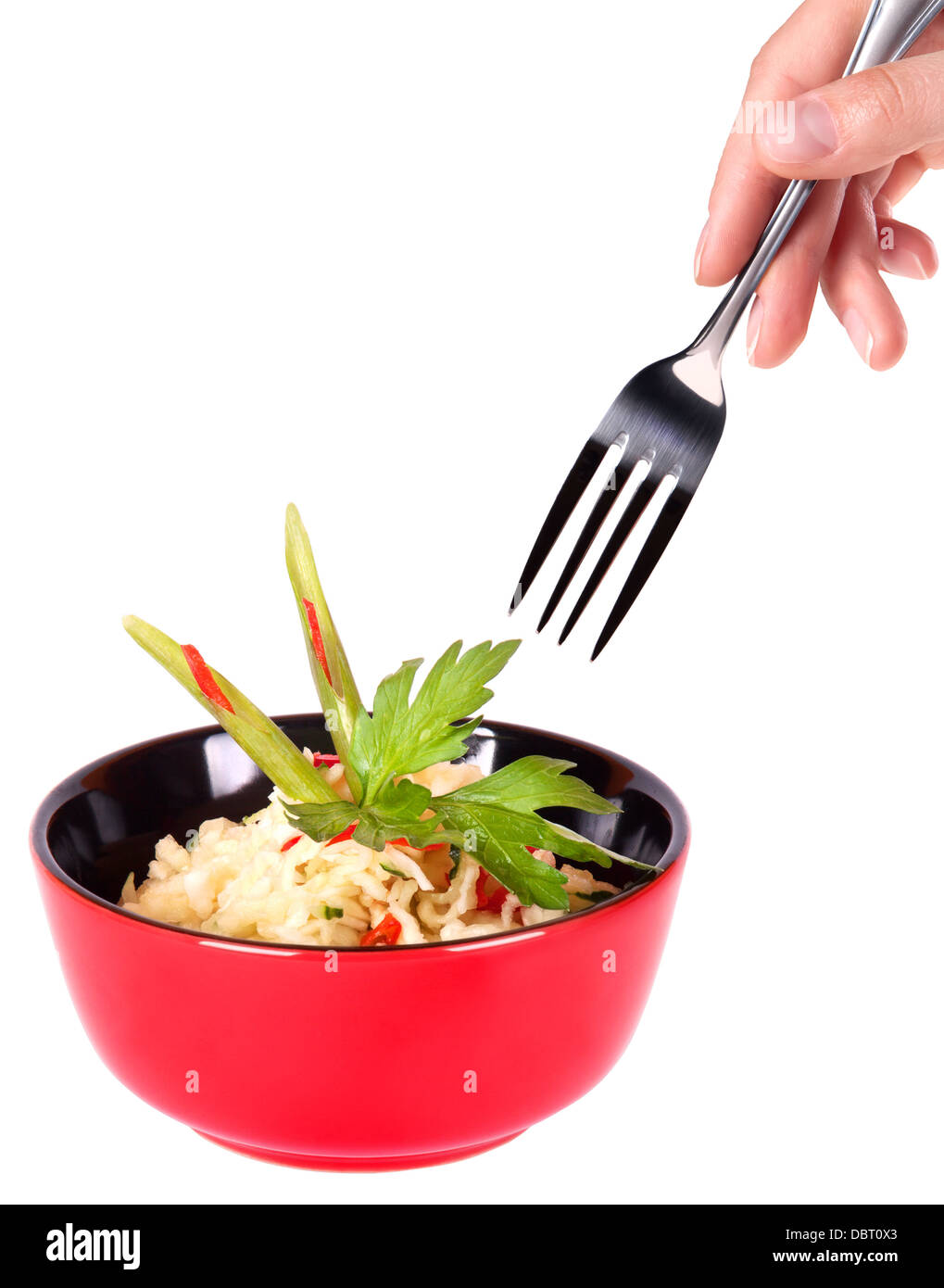 Healthy Chinese food in a red plate and hand with fork isolated on a ...