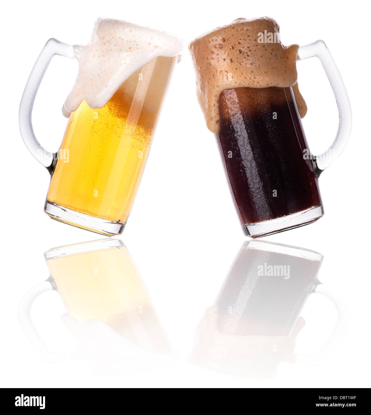 Pair of beer glasses making a toast isolated on a white background ...