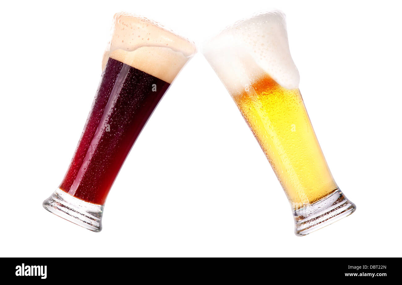 Pair of beer glasses making a toast isolated on a white background ...