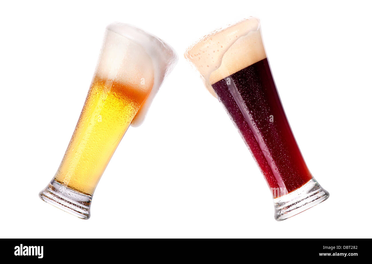 Pair of beer glasses making a toast isolated on a white background ...