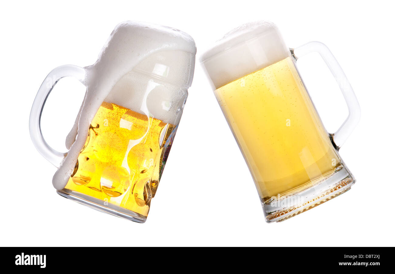 Pair of beer glasses making a toast isolated on a white background ...