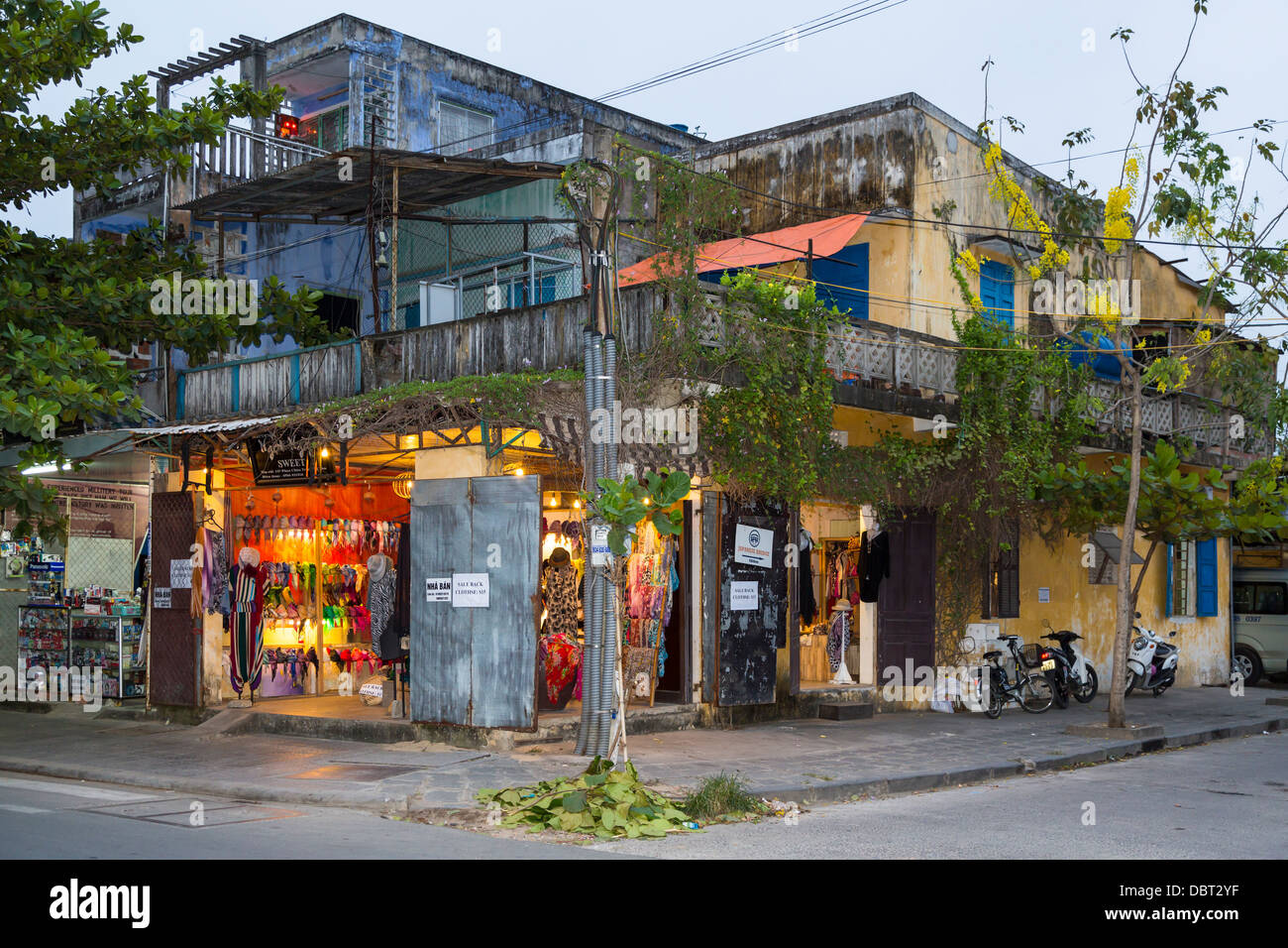 Shops and restaurants on a street corner in Hoi An, Vietnam, Asia Stock ...