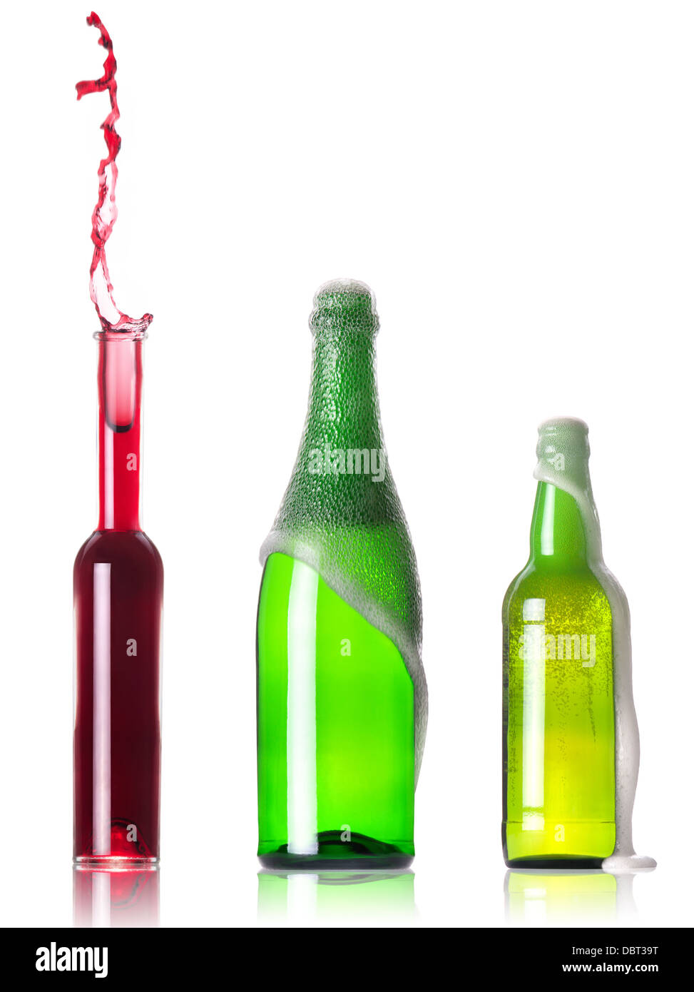 Lots bottles of various alcoholic drinks with splashes and foam ...