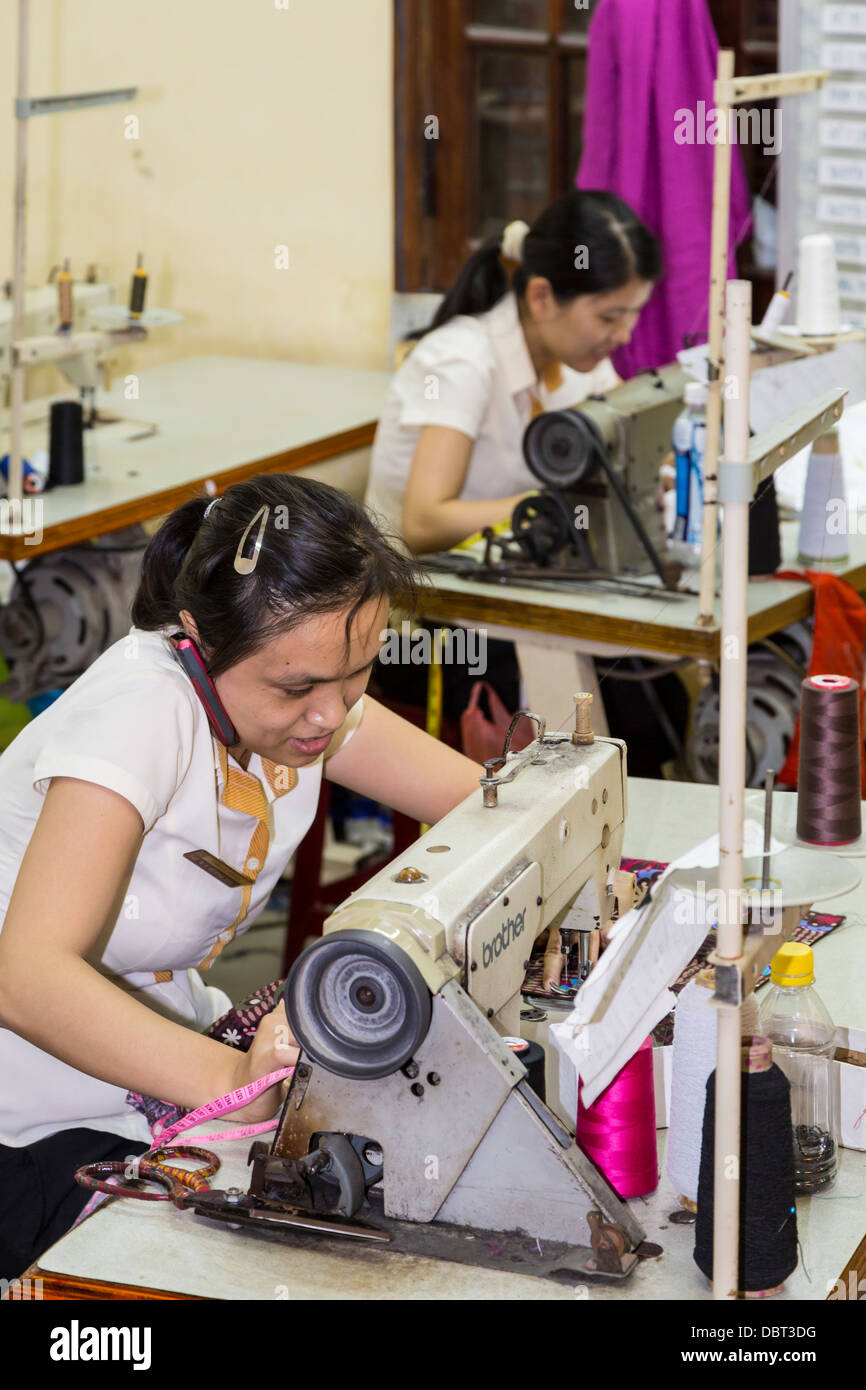 Girls working at a silk factory in Hoi An, Vietnam, Asia Stock Photo ...