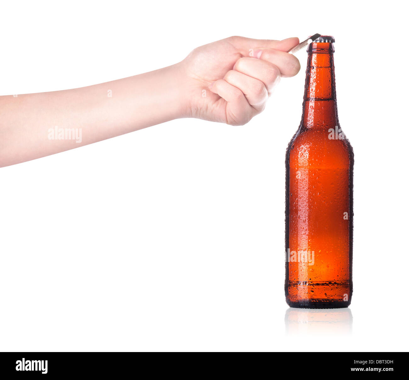 hand holding and opening beer bottle with metal opener Stock Photo - Alamy