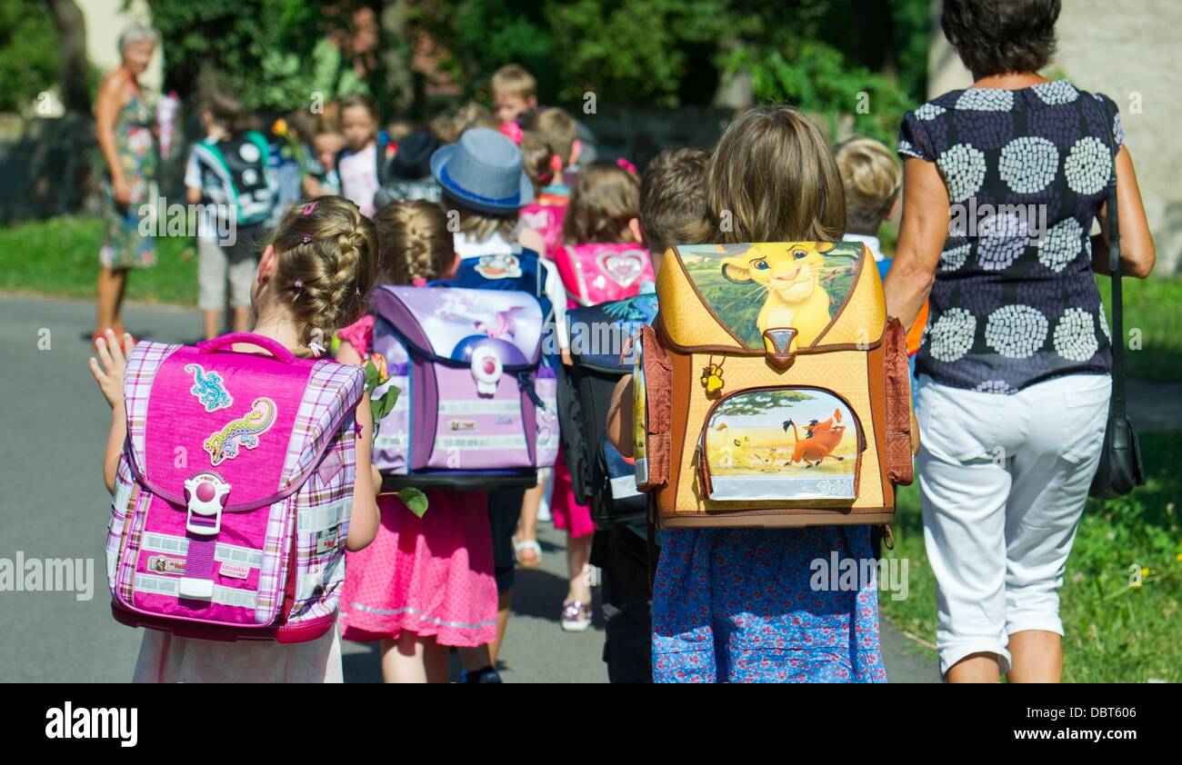 Future first-graders of an elementary school walk next to their teacher ...