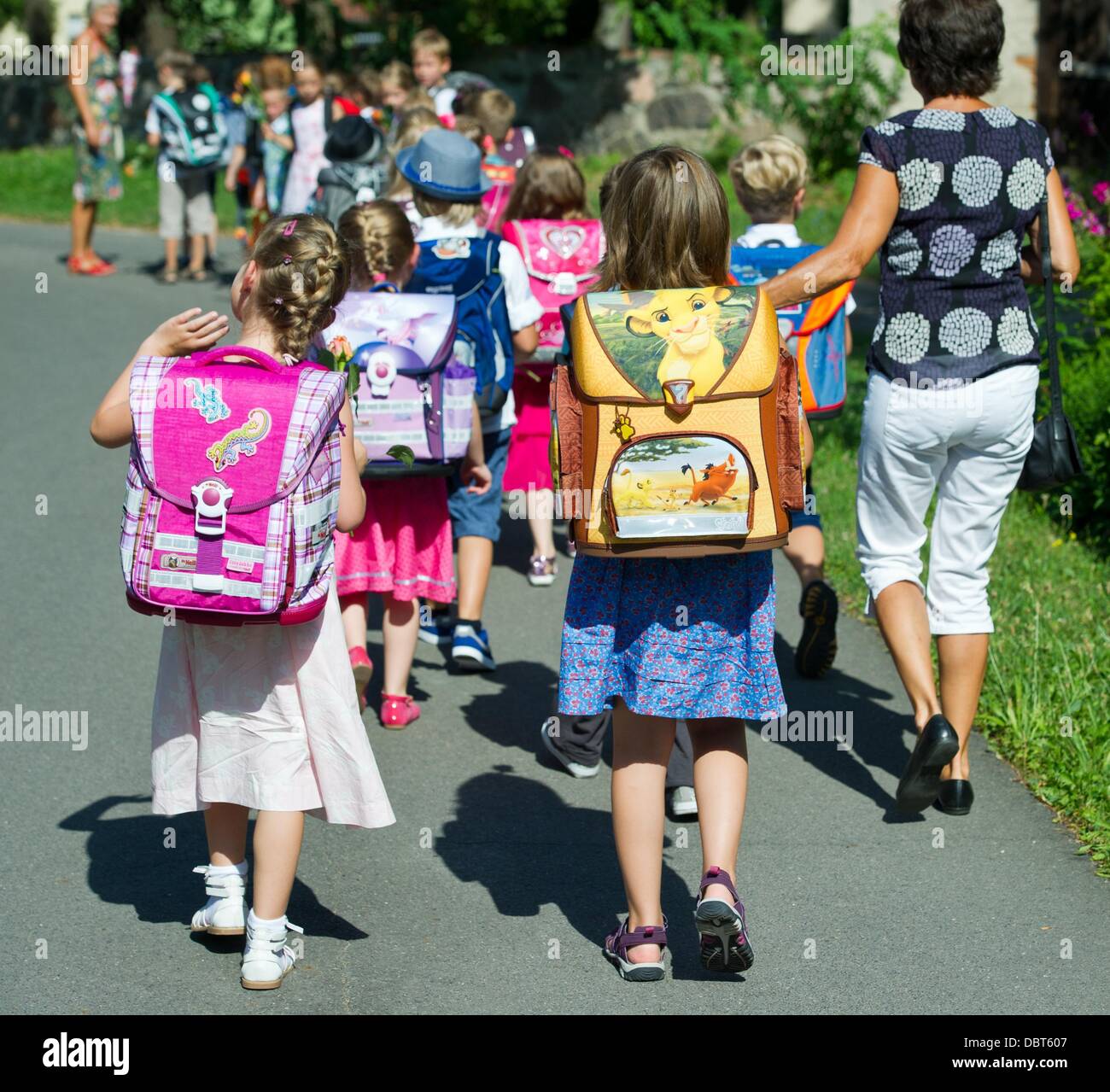 Future first-graders of an elementary school walk next to their teacher ...