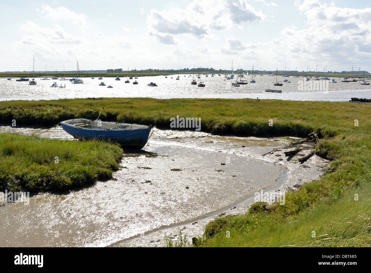Beached boat in a creek beside the River Alde at Slaughden, near ...