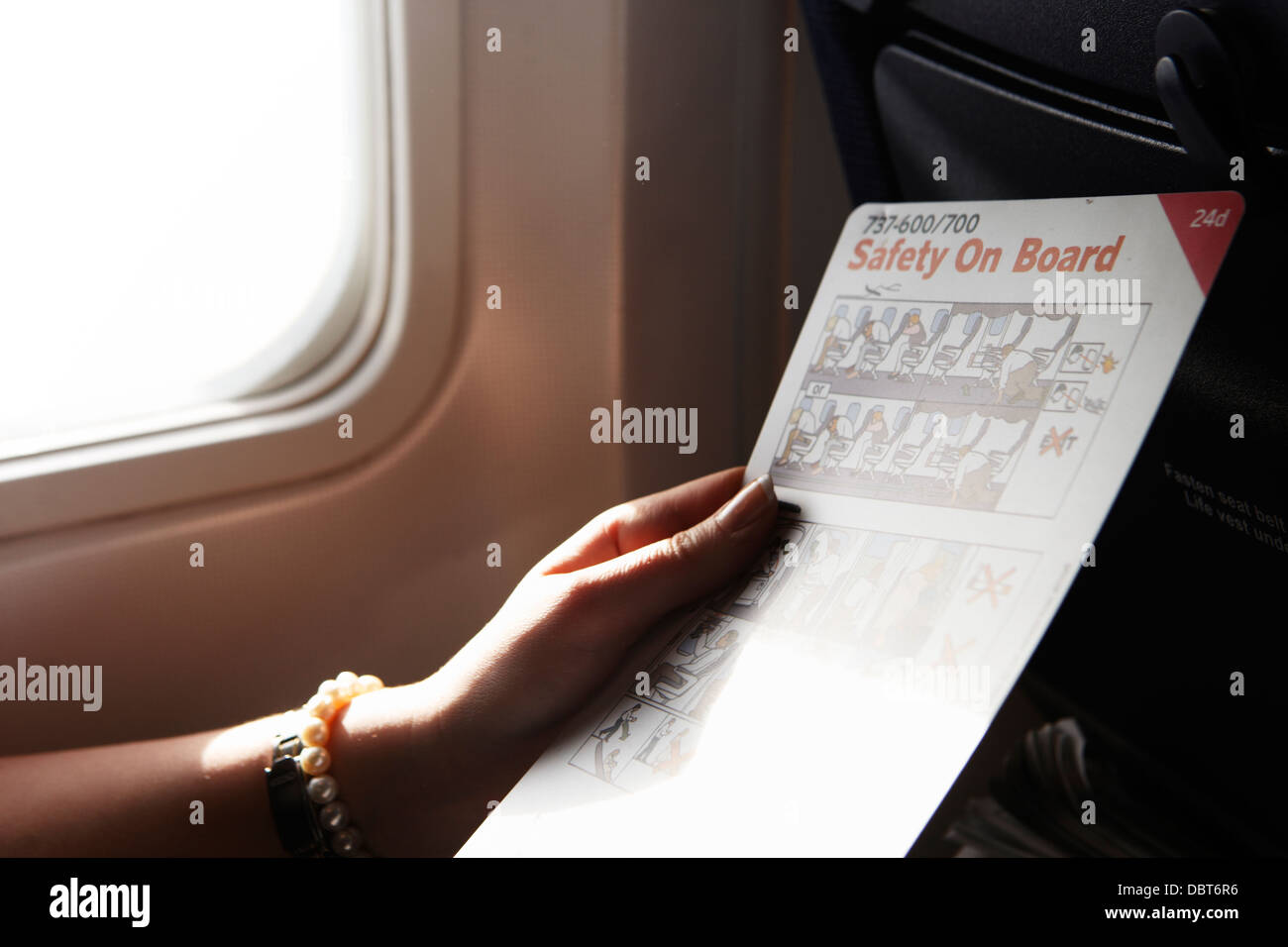 Female hand holding instruction manual Stock Photo - Alamy