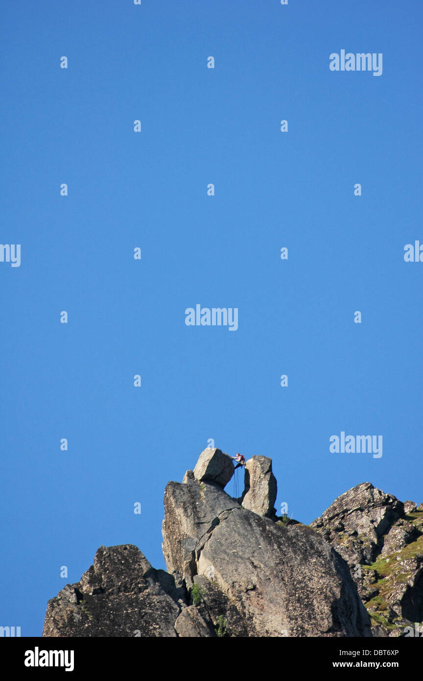 Climbing mountaineer on top of "Svolvær Goat" in Svolvær, Lofoten ...