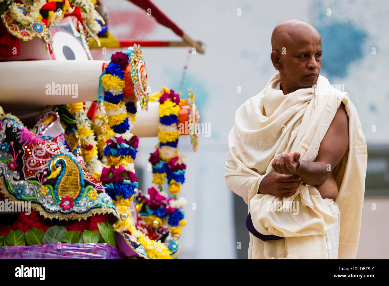 Leicester, UK, 4th August 2013. A Hare Krishna follower atop a chariot ...