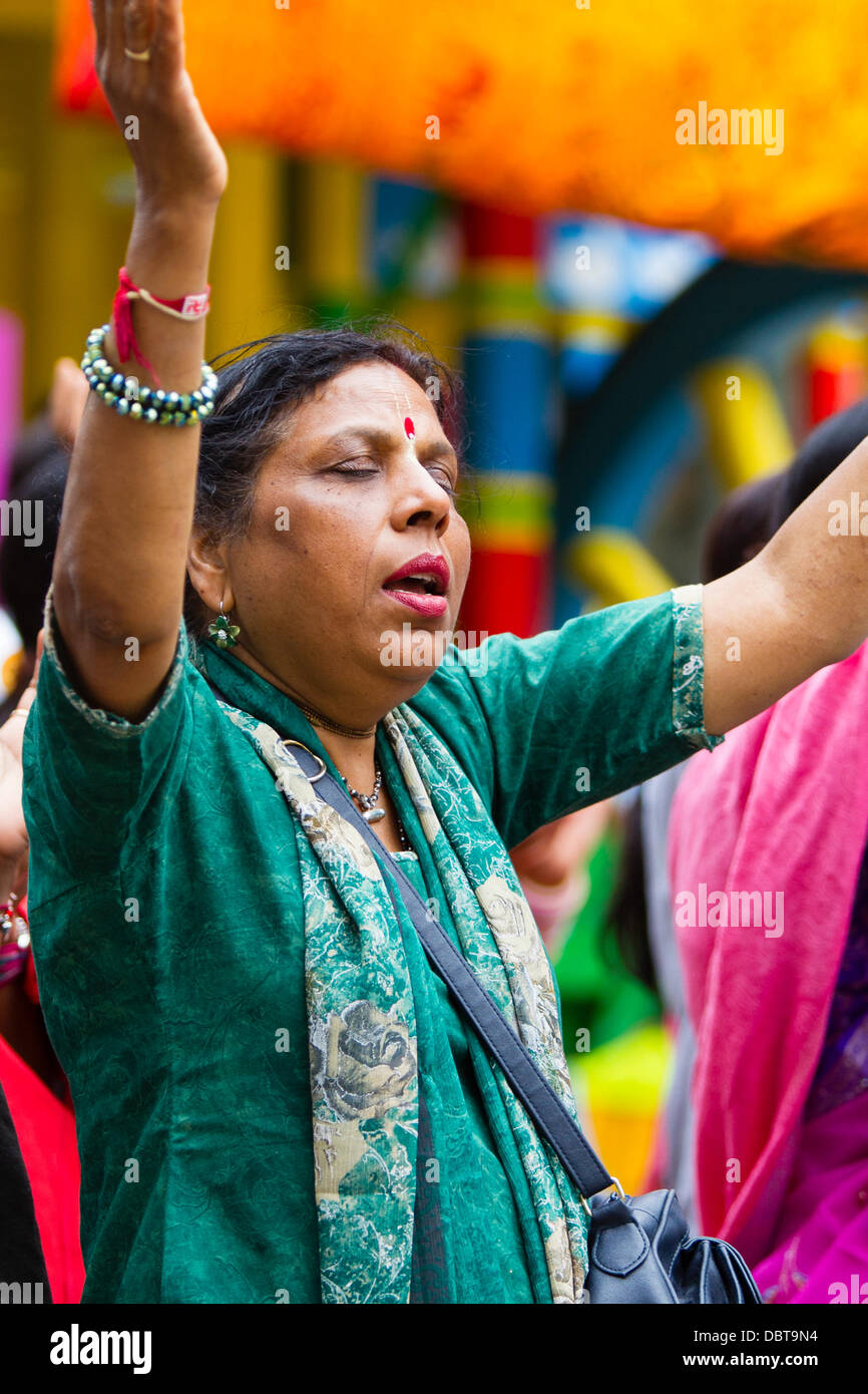 Leicester, UK, 4th August 2013. A Hare Krishna follower dances during ...