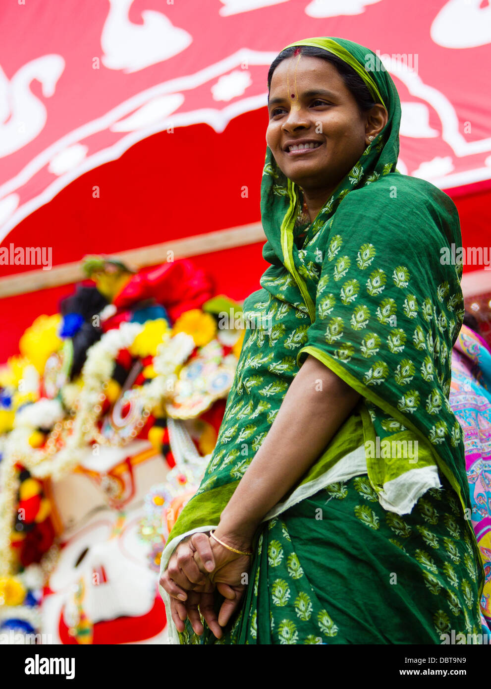 Leicester, UK, 4th August 2013. A Hare Krishna follower atop a chariot ...