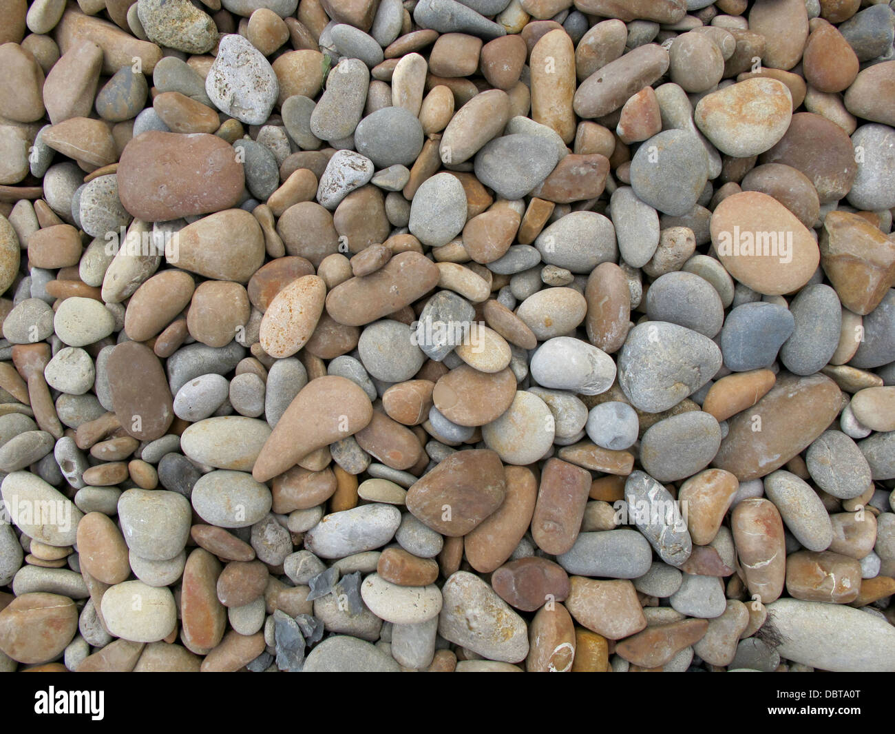 Background made of a closeup of a pile of pebbles Stock Photo - Alamy