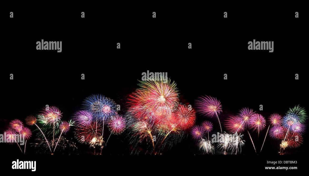 Fireworks in different shapes covering the bottom part of a black ...