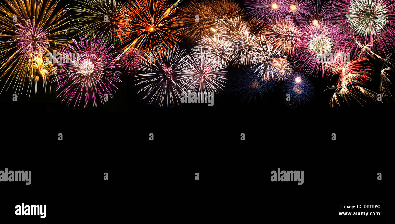 Fireworks in different shapes covering the top part of a black ...