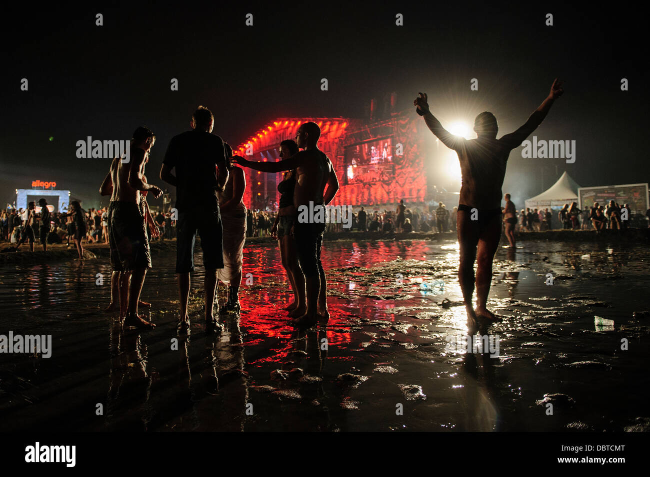 Festival participants having fun in the mud pool of the Przystanek ...