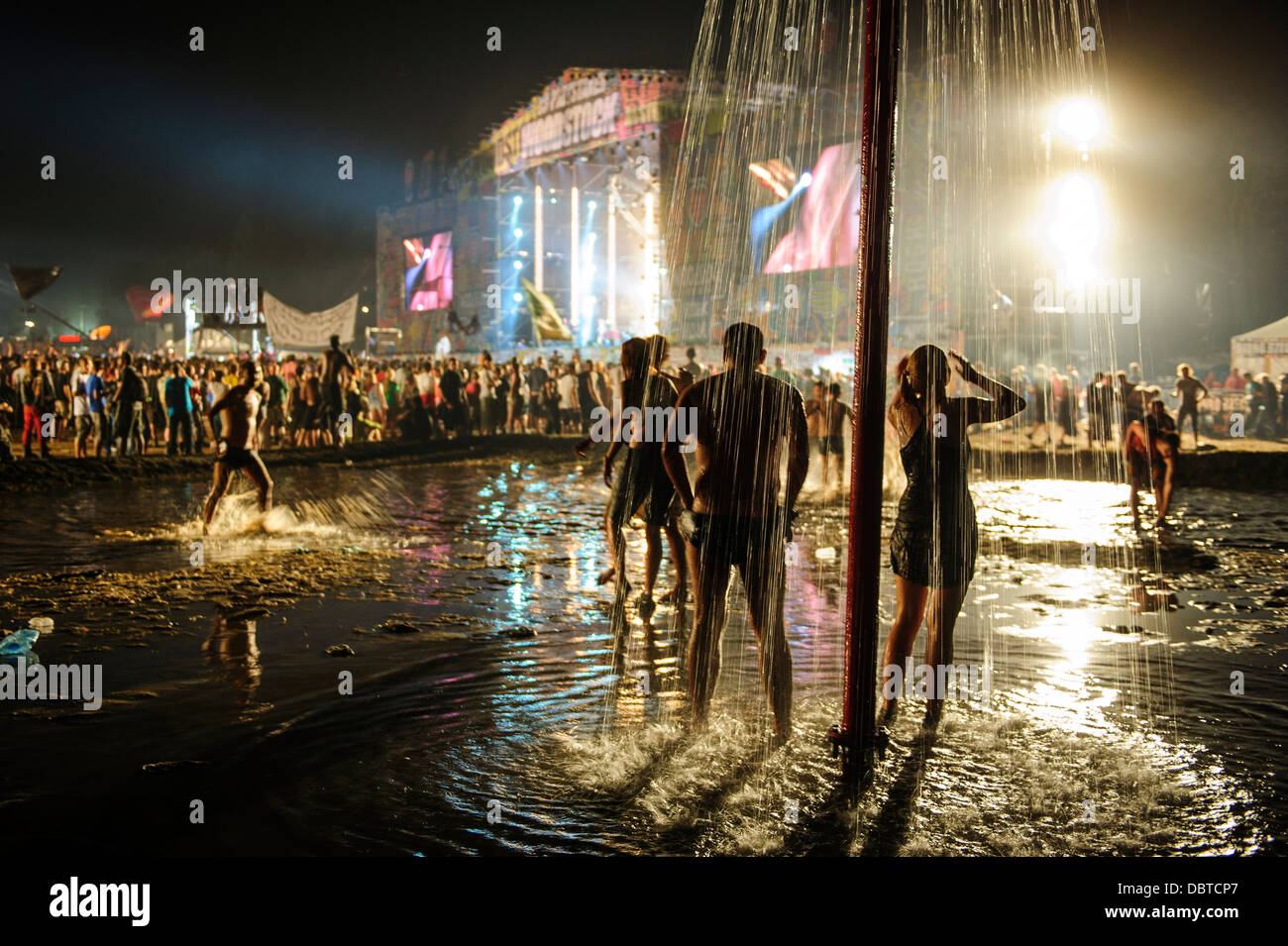Festival participants having fun in the mud pool of the Przystanek ...