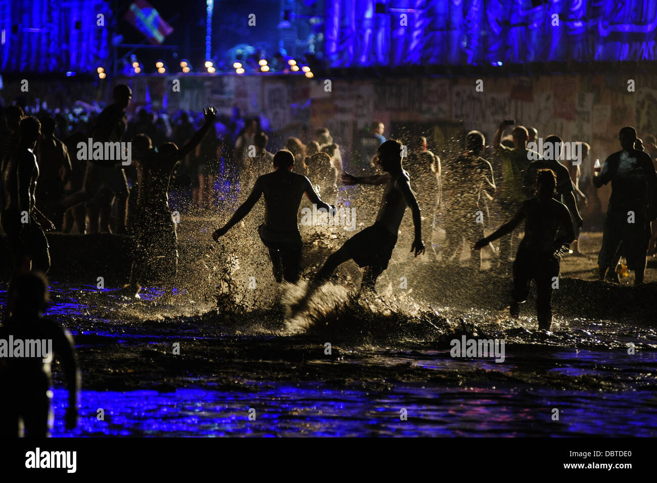 People having fun in the mud pool of the Przystanek Woodstock Music ...