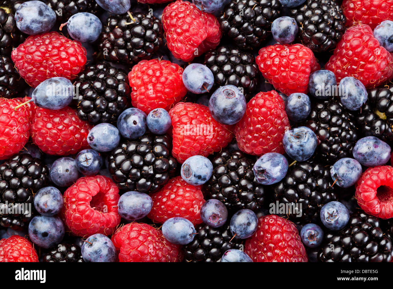 Raspberry, blackberry and blueberry background Stock Photo - Alamy