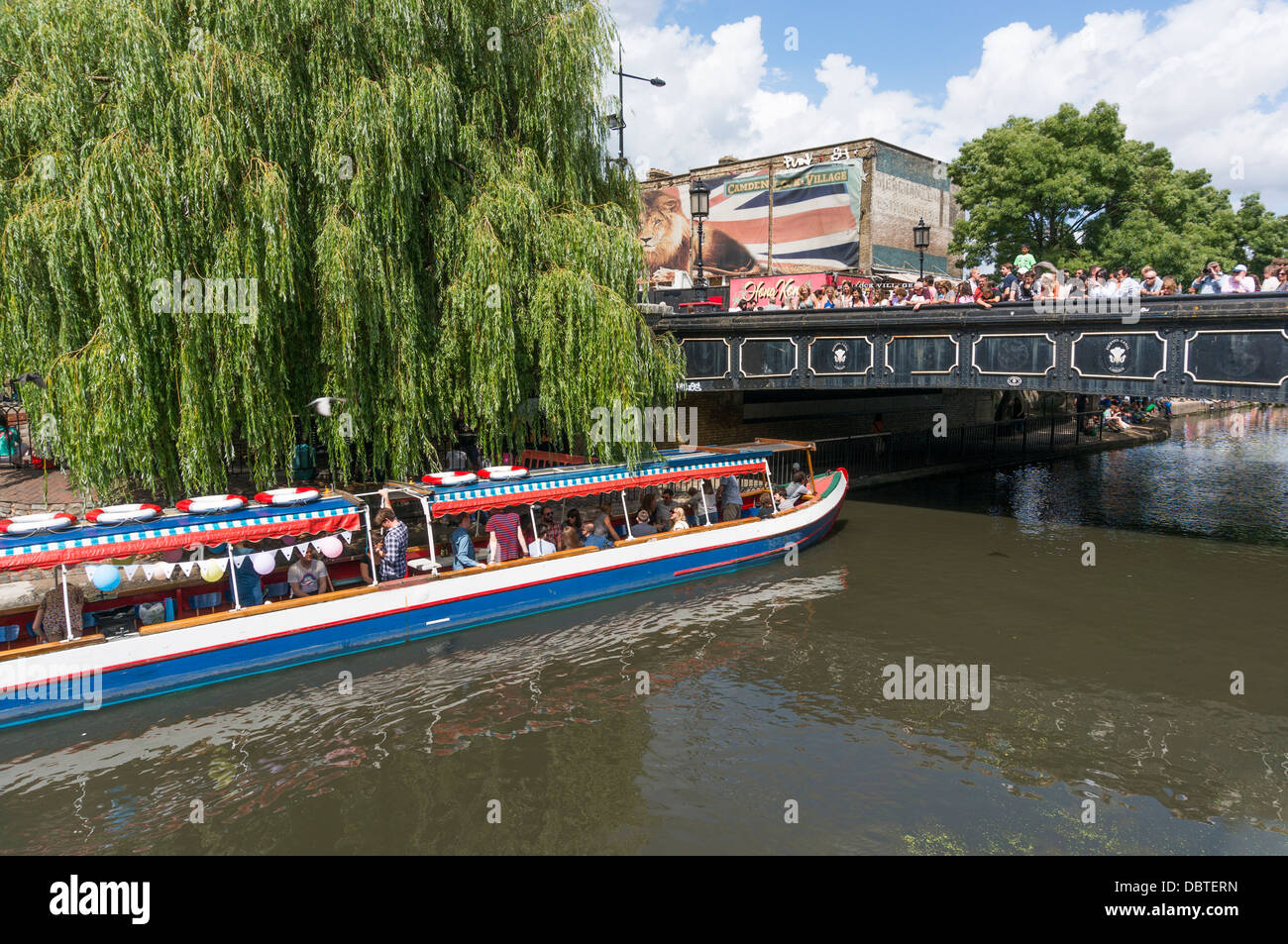 A waterbus on Camden Lock, near Camden Market, going under Regents ...